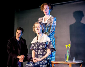 Greg Crane as Tom Wingfield; Standing Carolyn Arnold as Laura Wingfiled ...